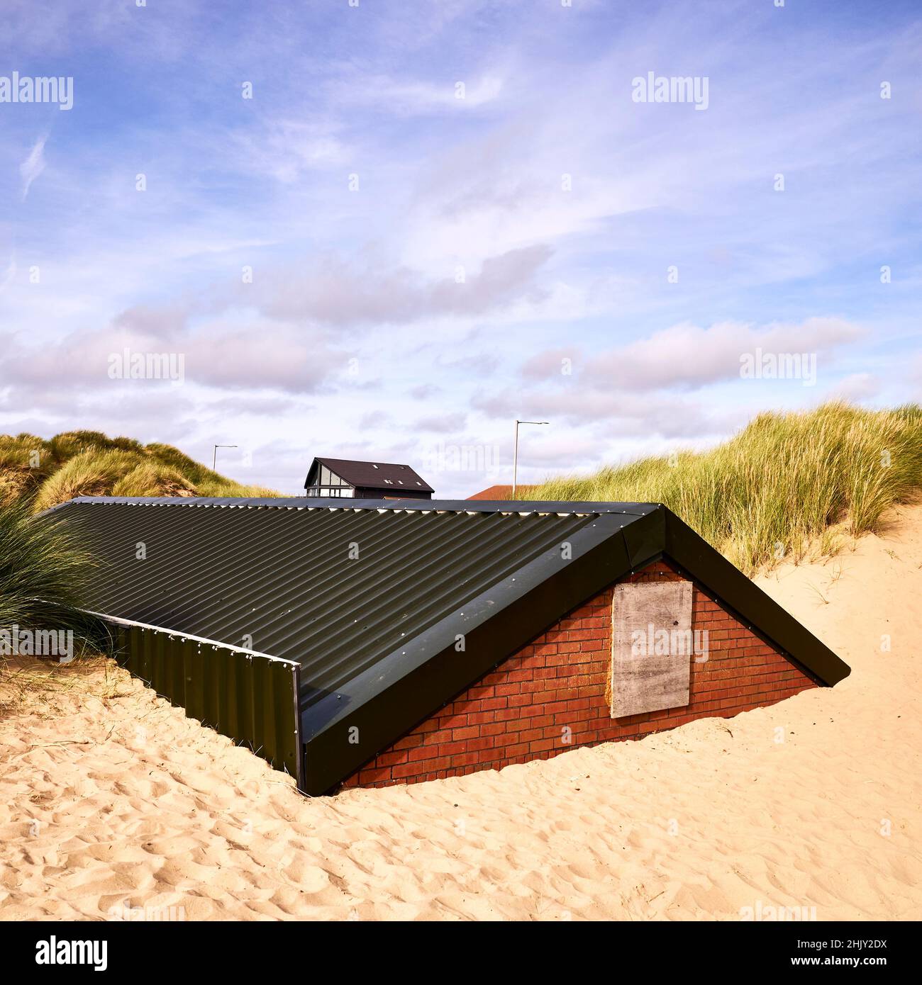 Building buried by sand Stock Photo - Alamy