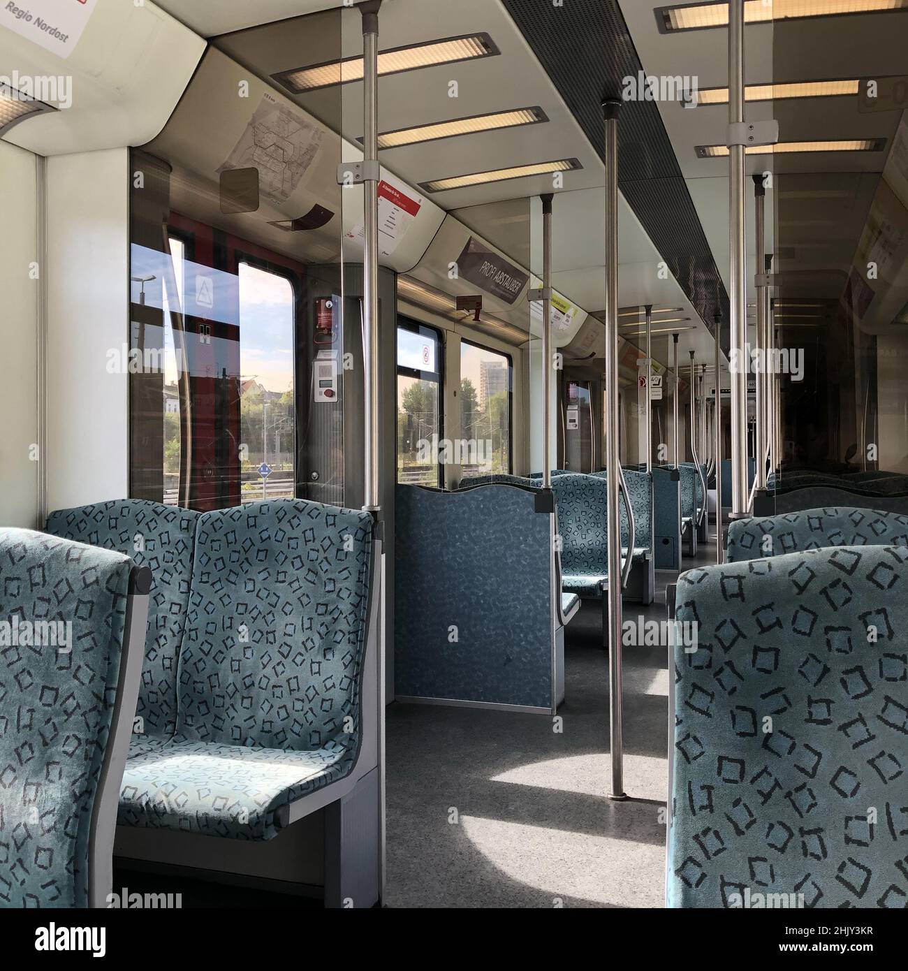 Interior view of a bus with blue seats Stock Photo - Alamy