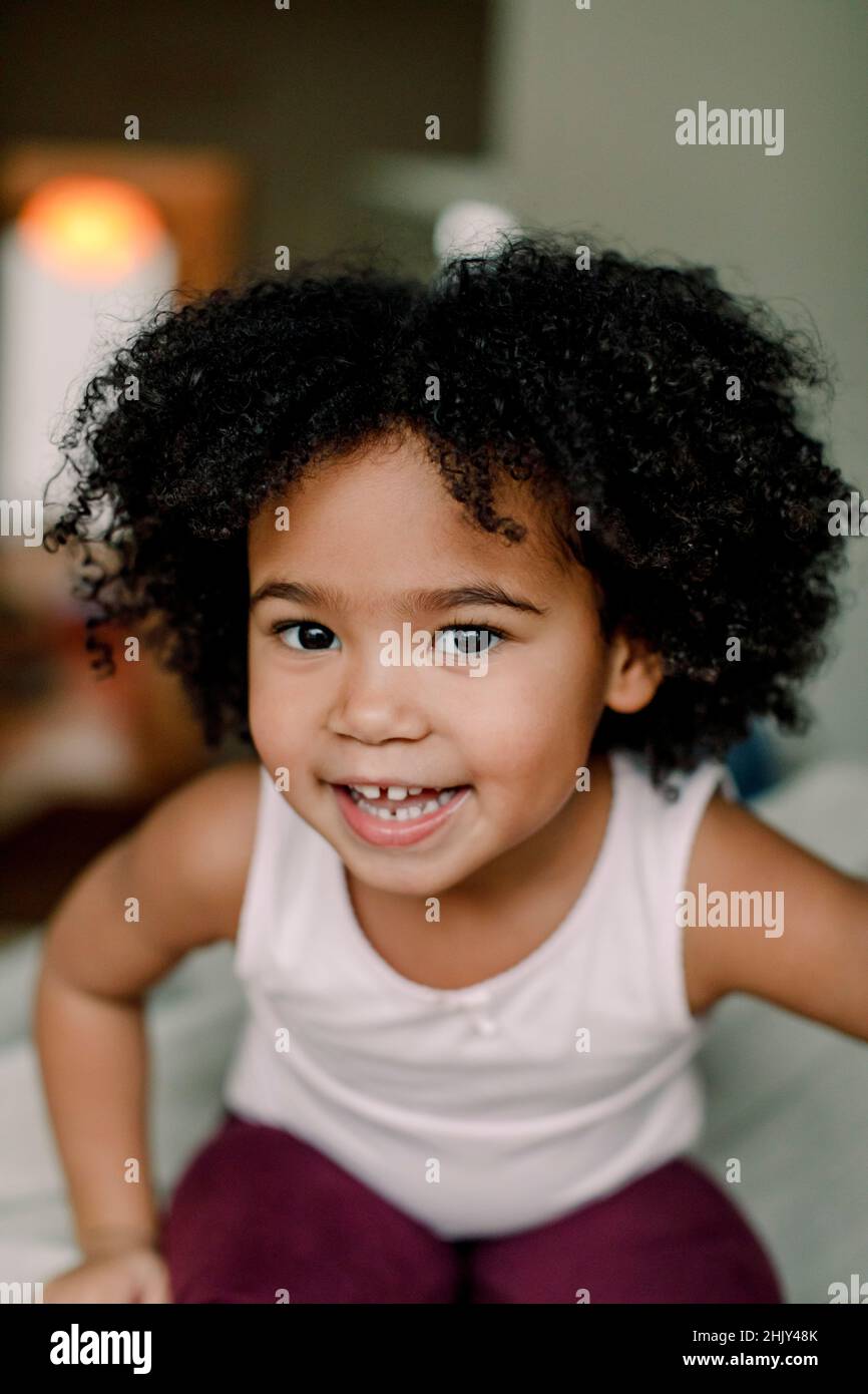 Portrait of smiling girl at home Stock Photo - Alamy