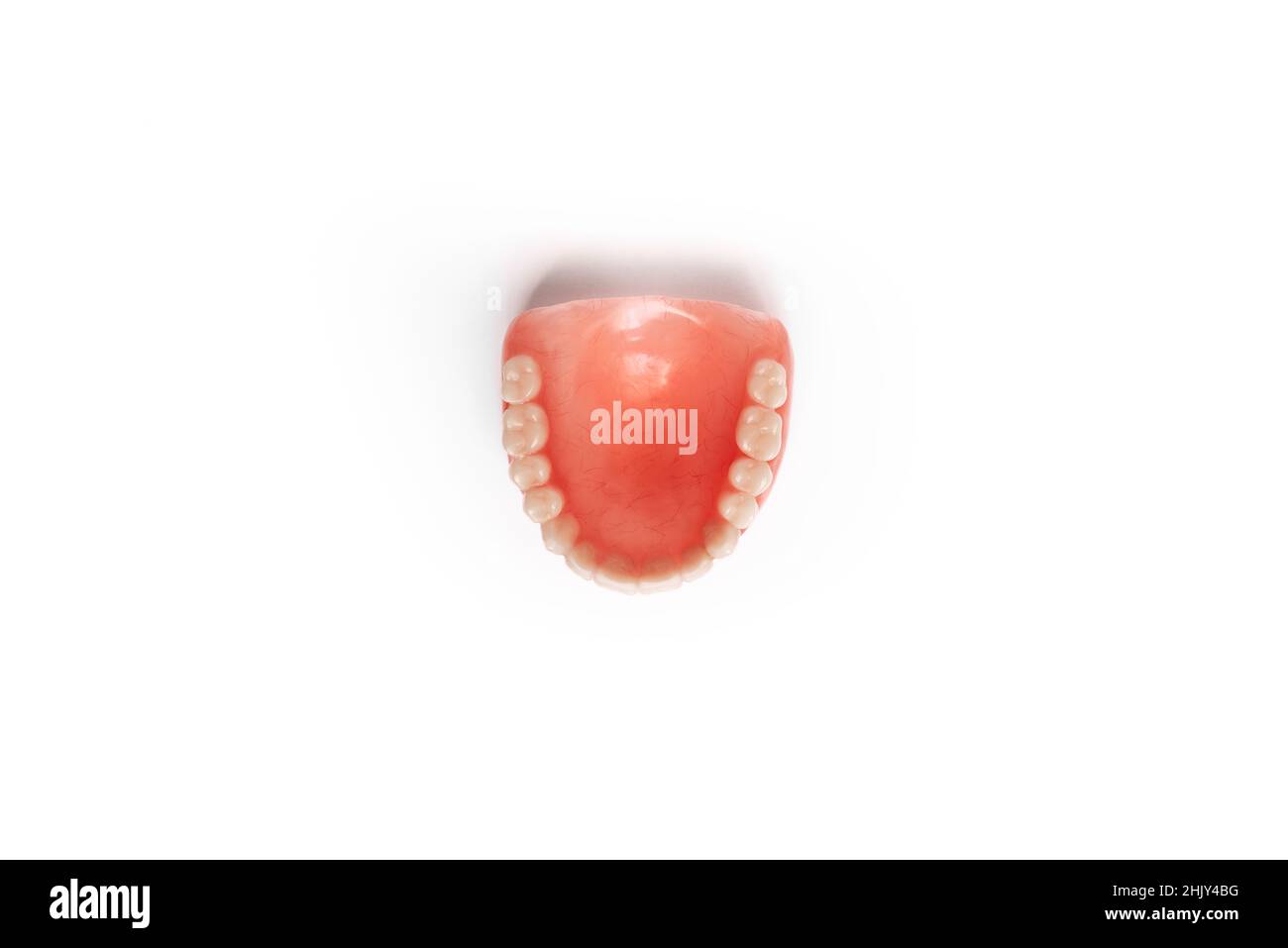 Top view of the upper denture on a white background. Dental prosthesis ...