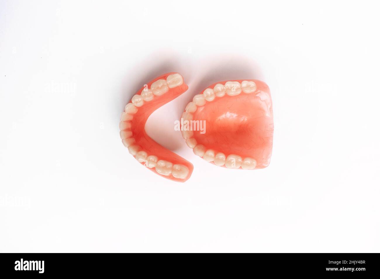 Top view of complete denture on white background. Full denture close-up ...