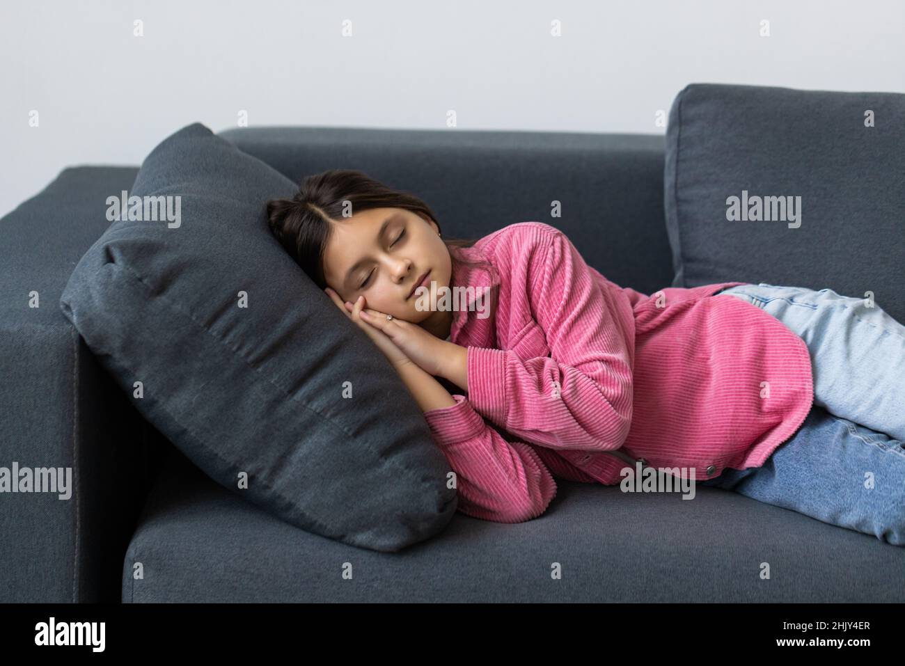 Beautiful teenage girl sleeping on sofa hi-res stock photography and ...