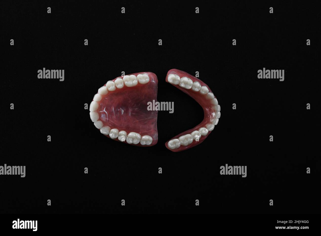 Full removable plastic denture of the jaws. A set of dentures on a ...