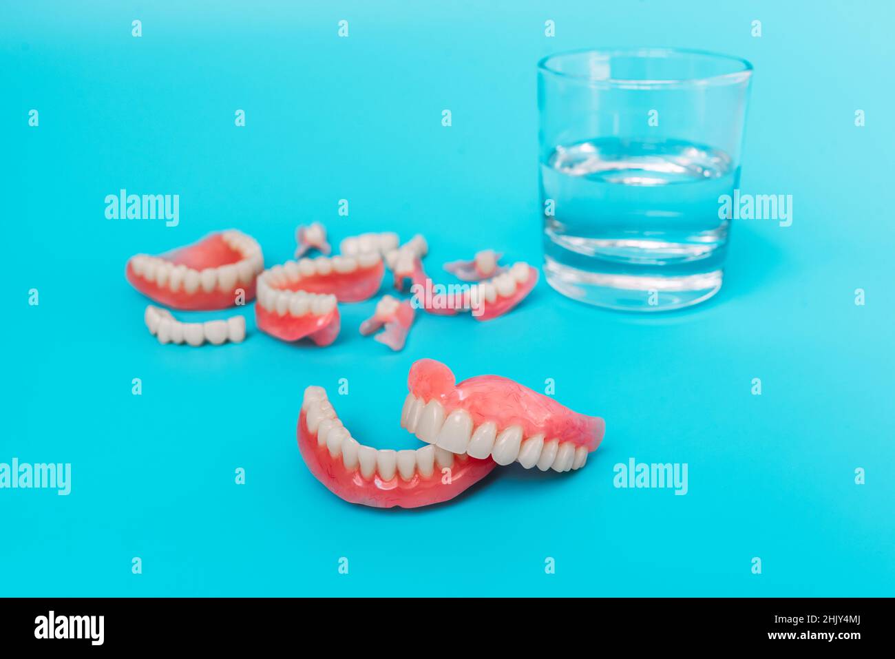 Dentures on a blue background. Close-up of dentures. Full removable ...