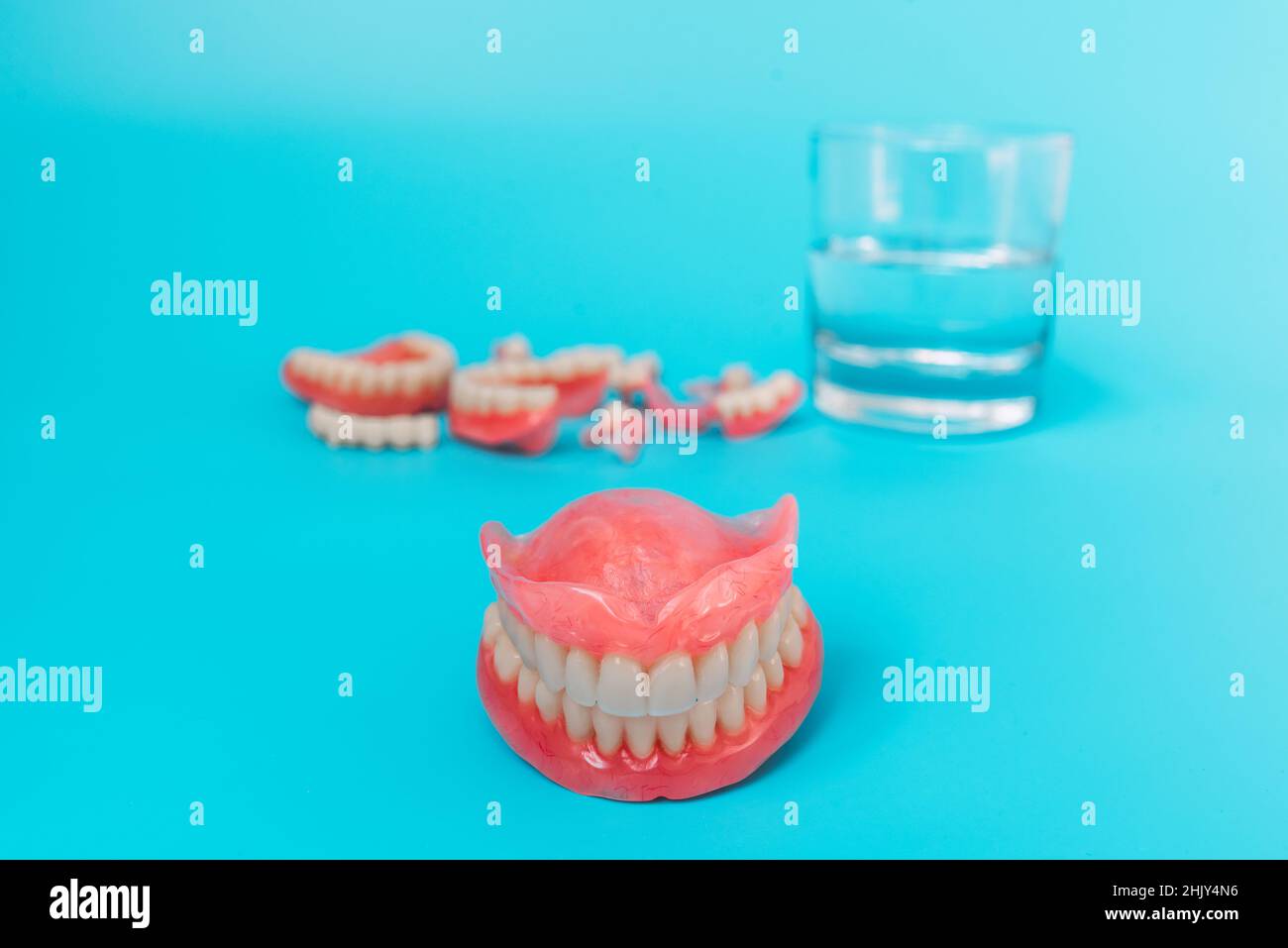 Dentures on a blue background. Close-up of dentures. Full removable ...