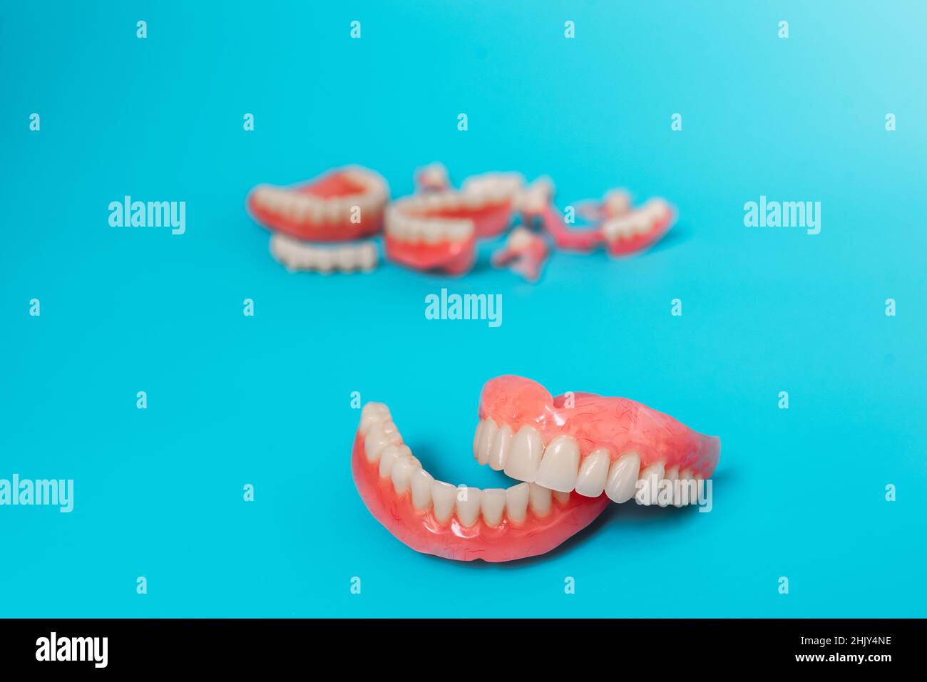 Dentures on a blue background. Close-up of dentures. Full removable ...