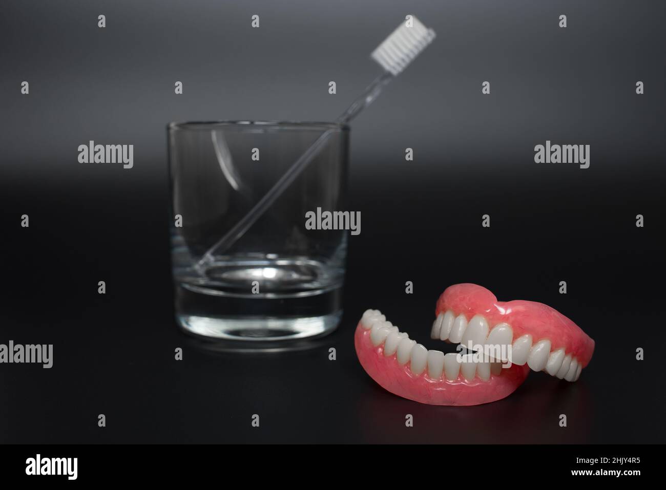 Full removable plastic denture of the jaws. A set of dentures on a ...