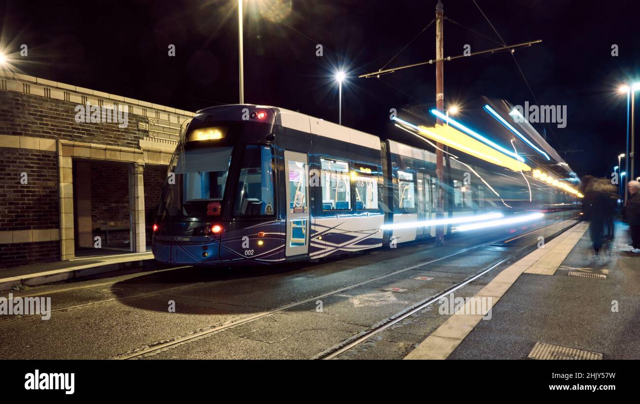 Trams passing in the night at tram station in Blackpool Stock Photo - Alamy