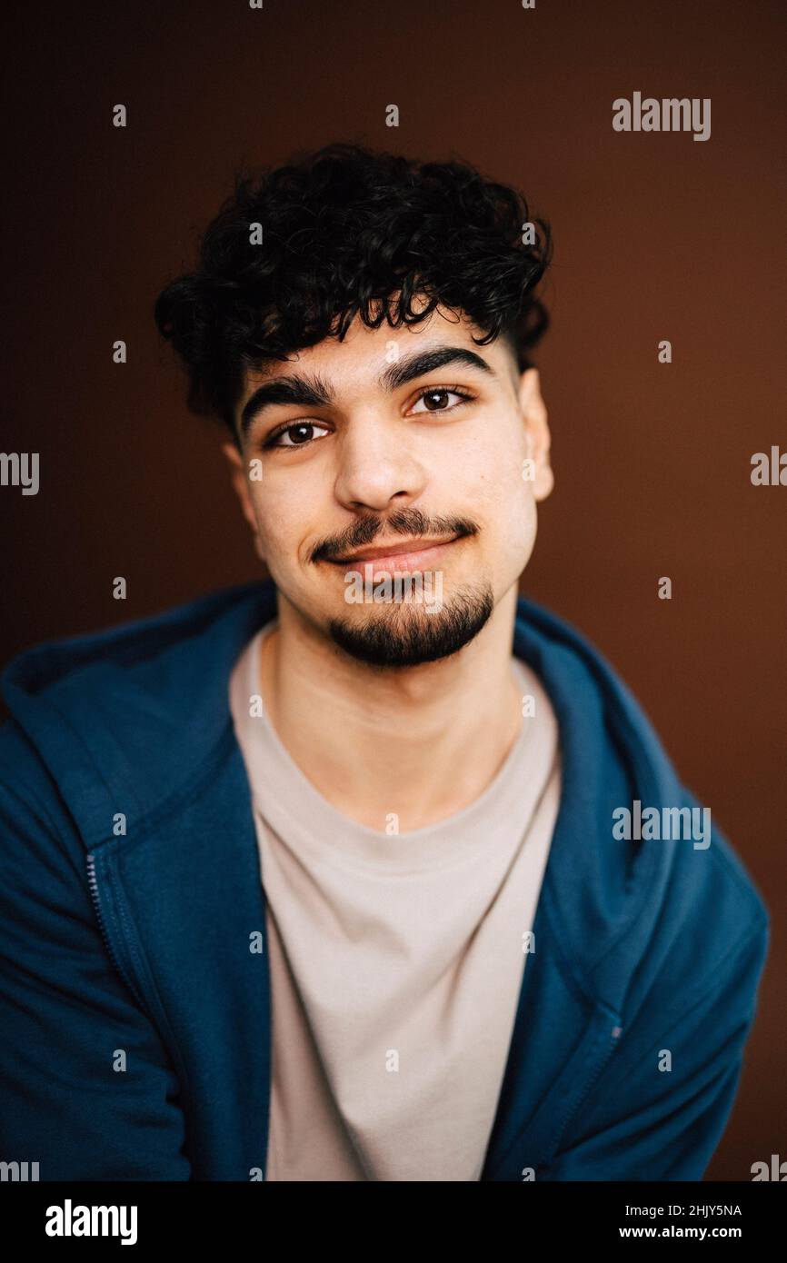 Young man brown hair hi-res stock photography and images - Alamy