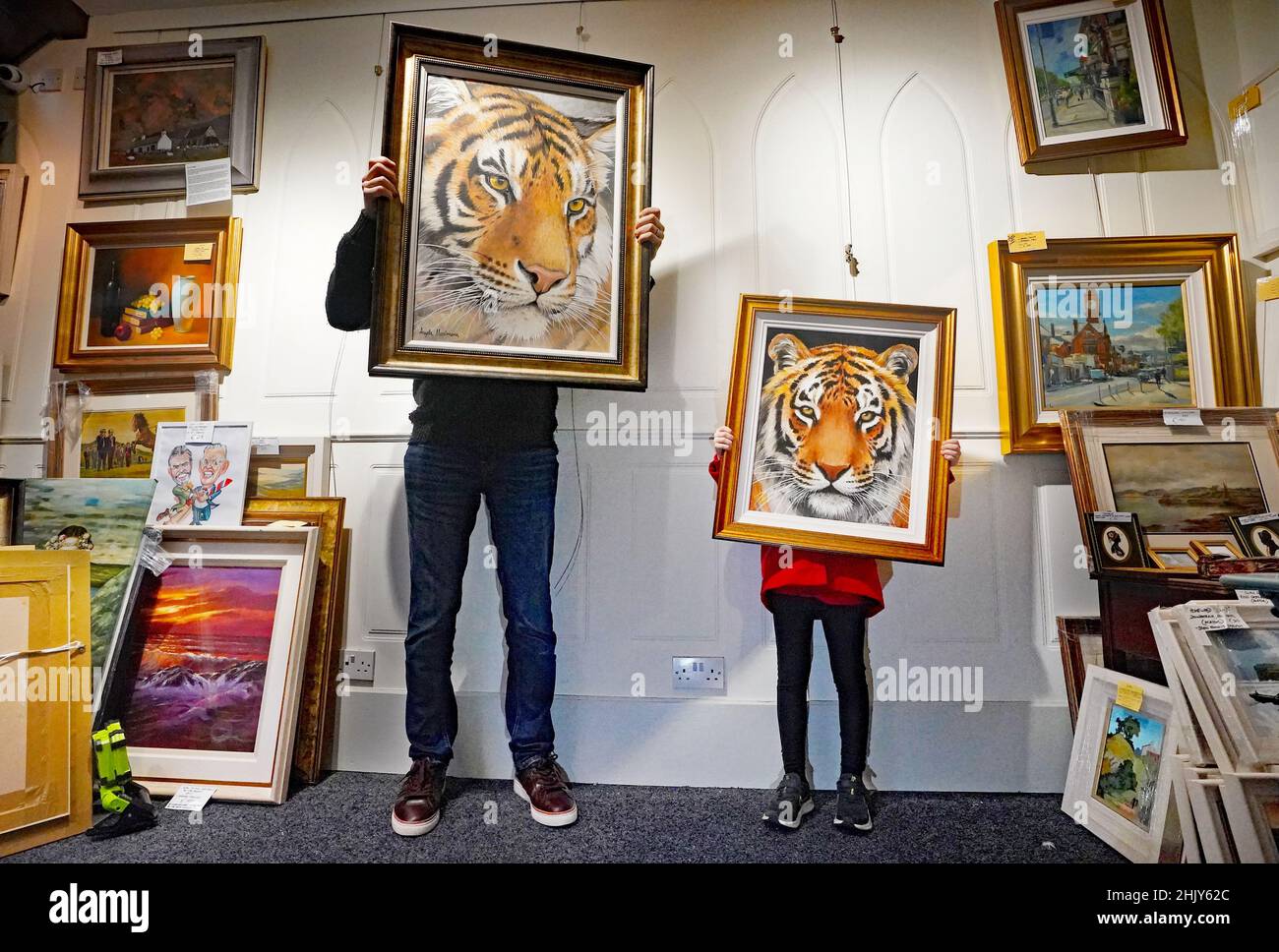 Gallery owner Fanck O'Dea and Aoife Mooney (7), pose with tiger oil ...