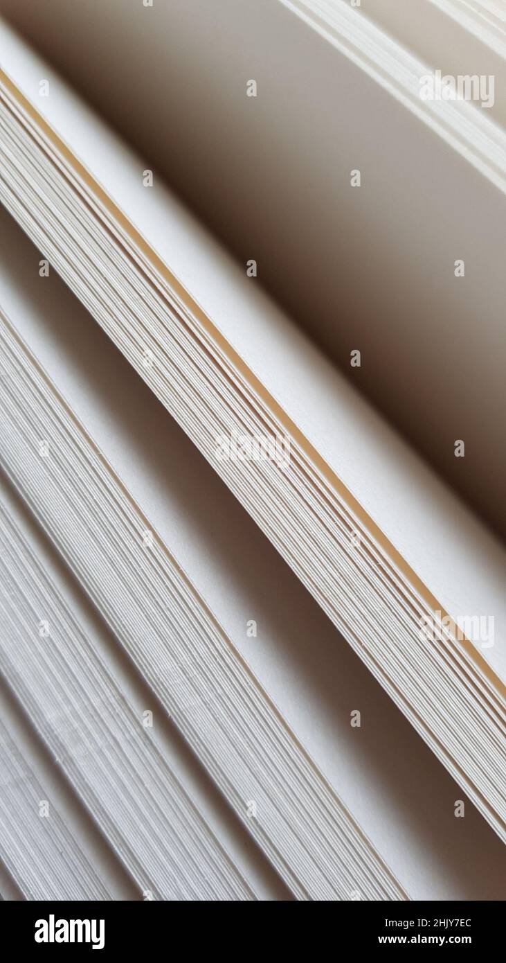 white blank sheets of thick notepad, half opened end view Stock Photo ...