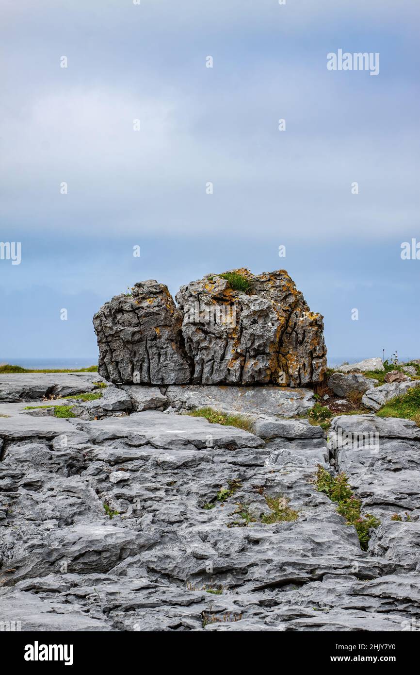 The Burren rocks form and Doolin area in sunny and cloudy day, seashore ...