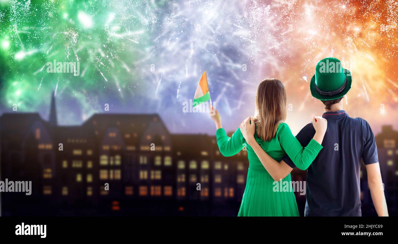 St Patrick day fireworks and parade. Irish party. Group of friends and ...