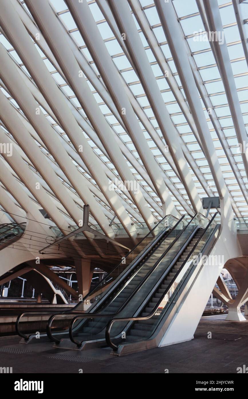 Vertical shot of an escalator inside a modern building Stock Photo - Alamy