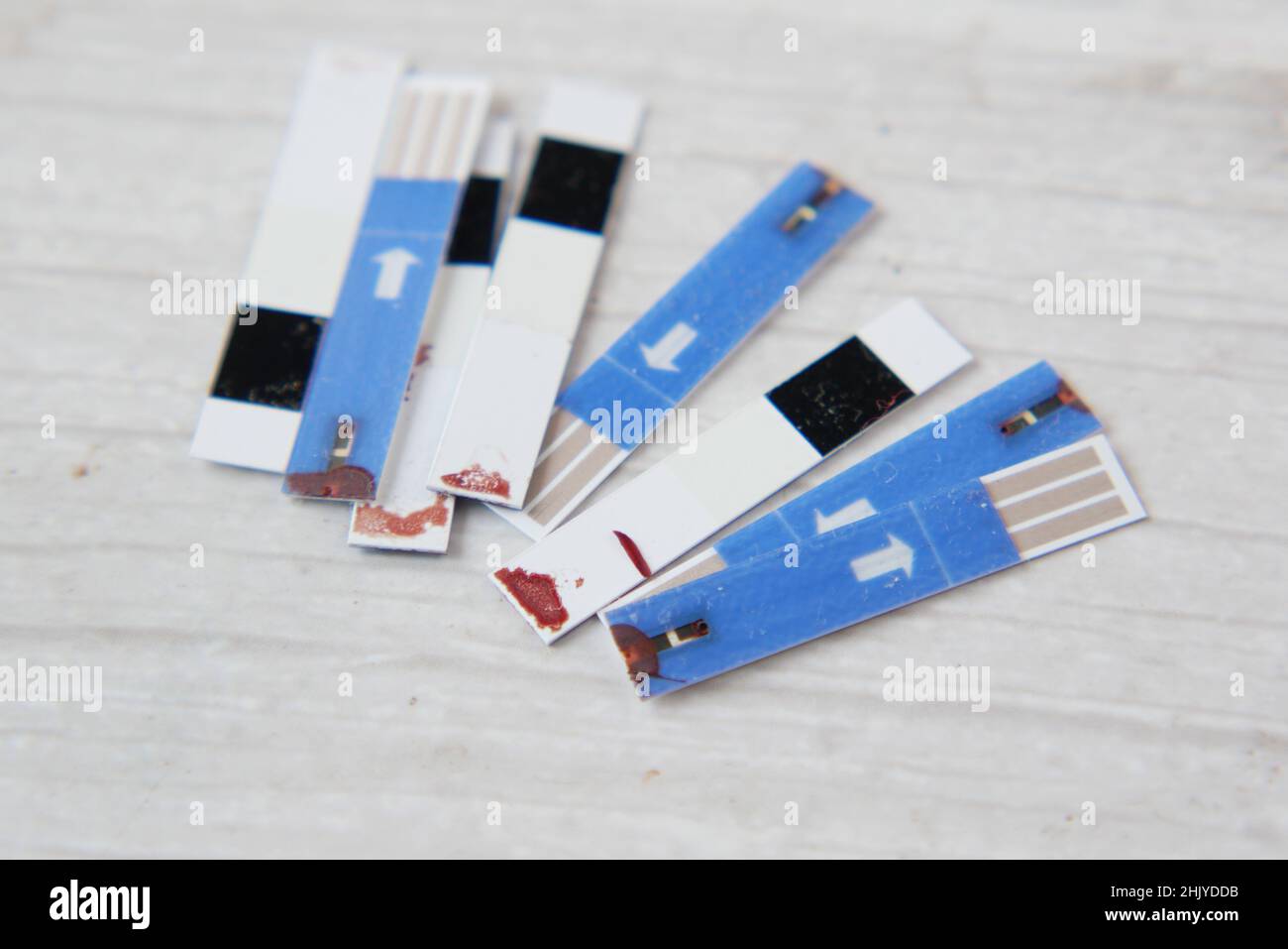 Close up of used diabetic strips on white background Stock Photo - Alamy