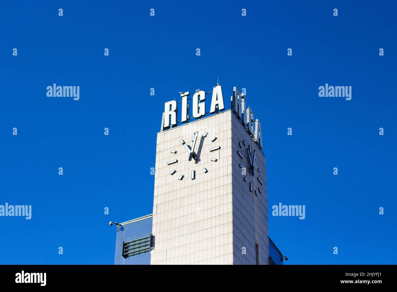Riga Train station clock tower. High quality photo, blue sky on a ...