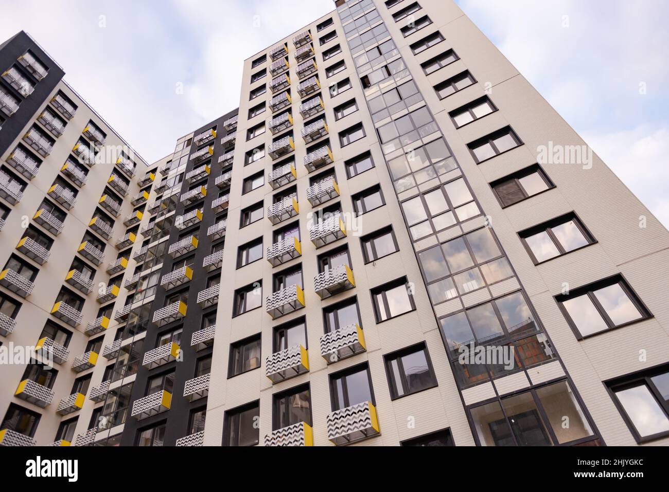 Facades of a new residential building. New multi-storey building in the ...