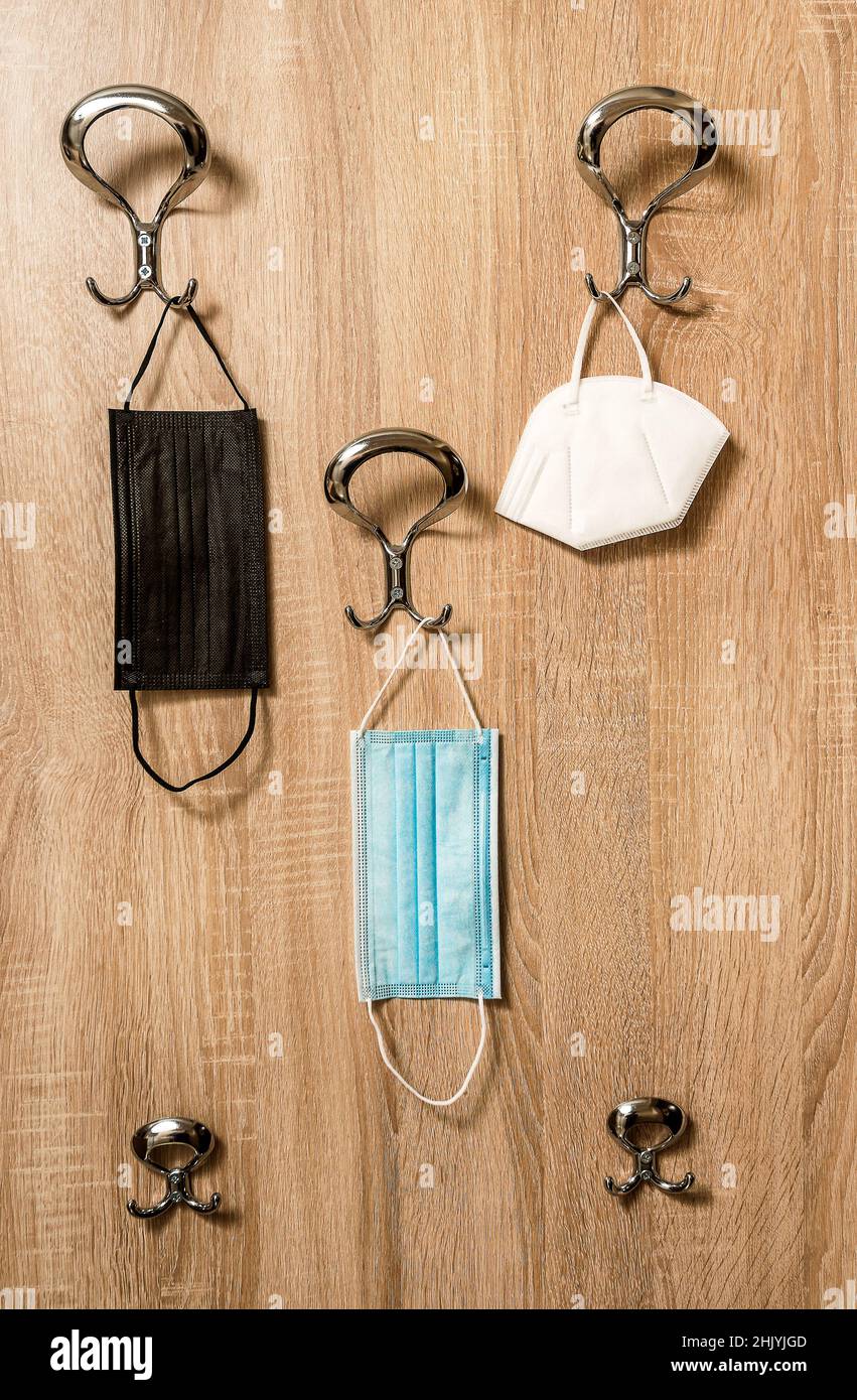 Protective surgical face masks on anteroom coat hanger stand during ...