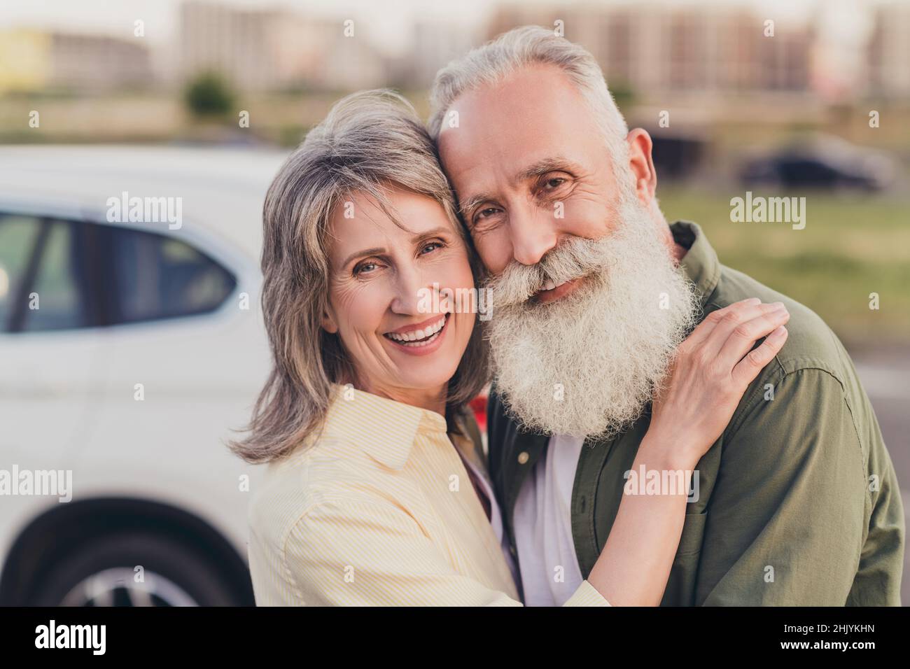 Photo of mature married couple cuddle romantic date urban rent car ...