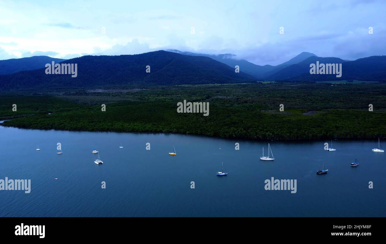 Ocean meets the river with rainforest backdrop in Cairns Stock Photo ...