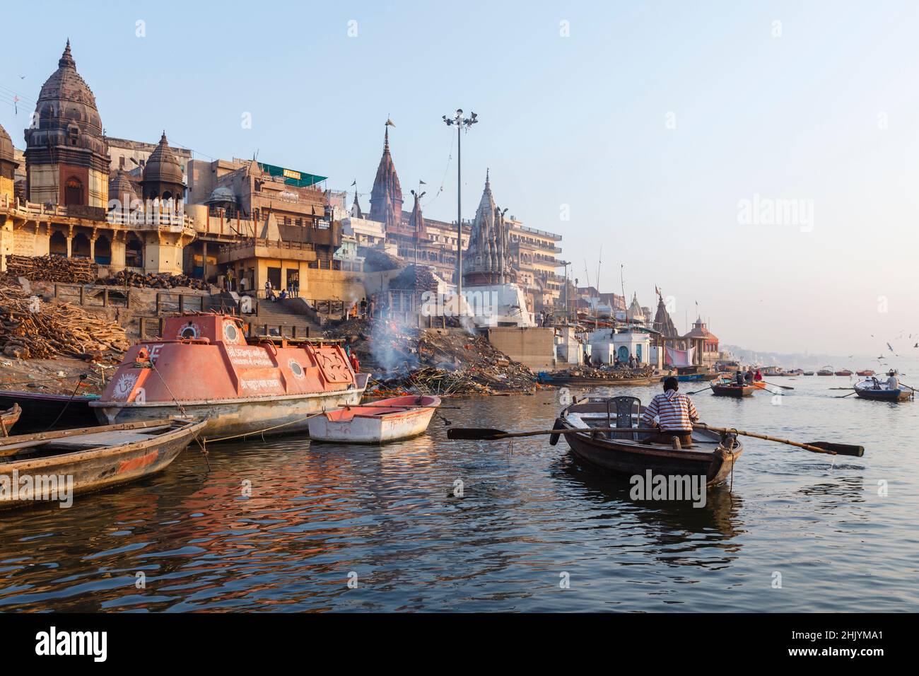 Funeral pyres burning on Manikarnika Ghat at Varanasi (formerly Banaras ...