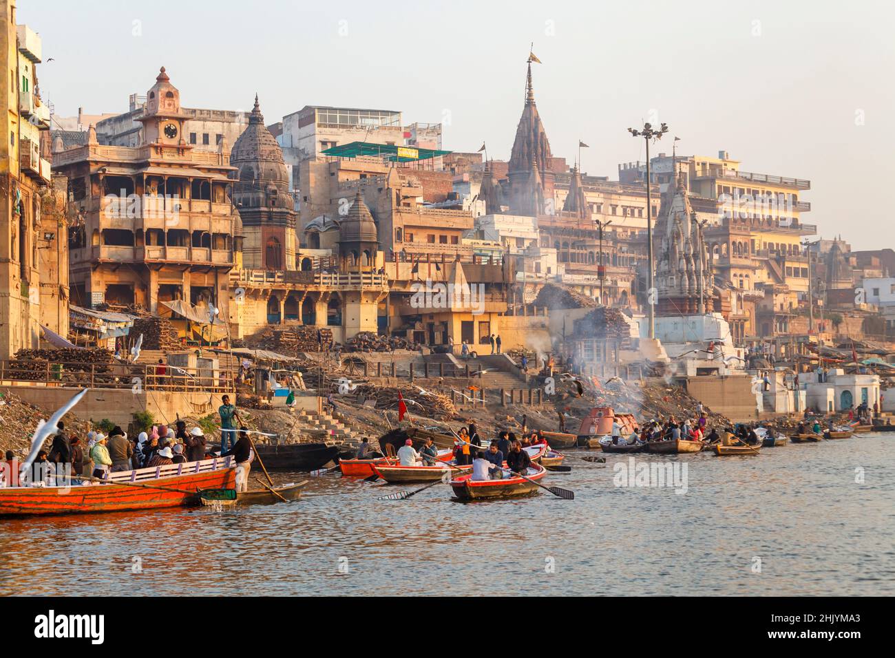 Funeral pyres burning on Manikarnika Ghat at Varanasi (formerly Banaras ...