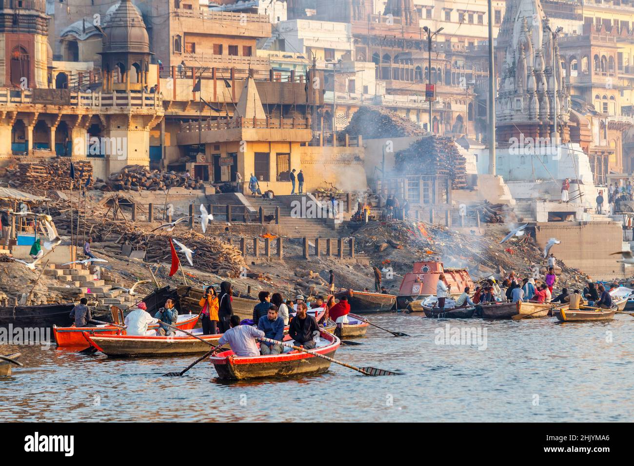 Funeral pyres burning on Manikarnika Ghat at Varanasi (formerly Banaras ...