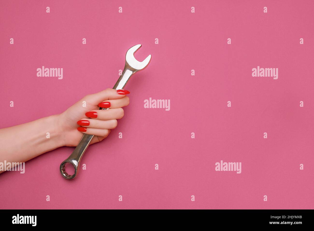 Woman wrench hi-res stock photography and images - Alamy