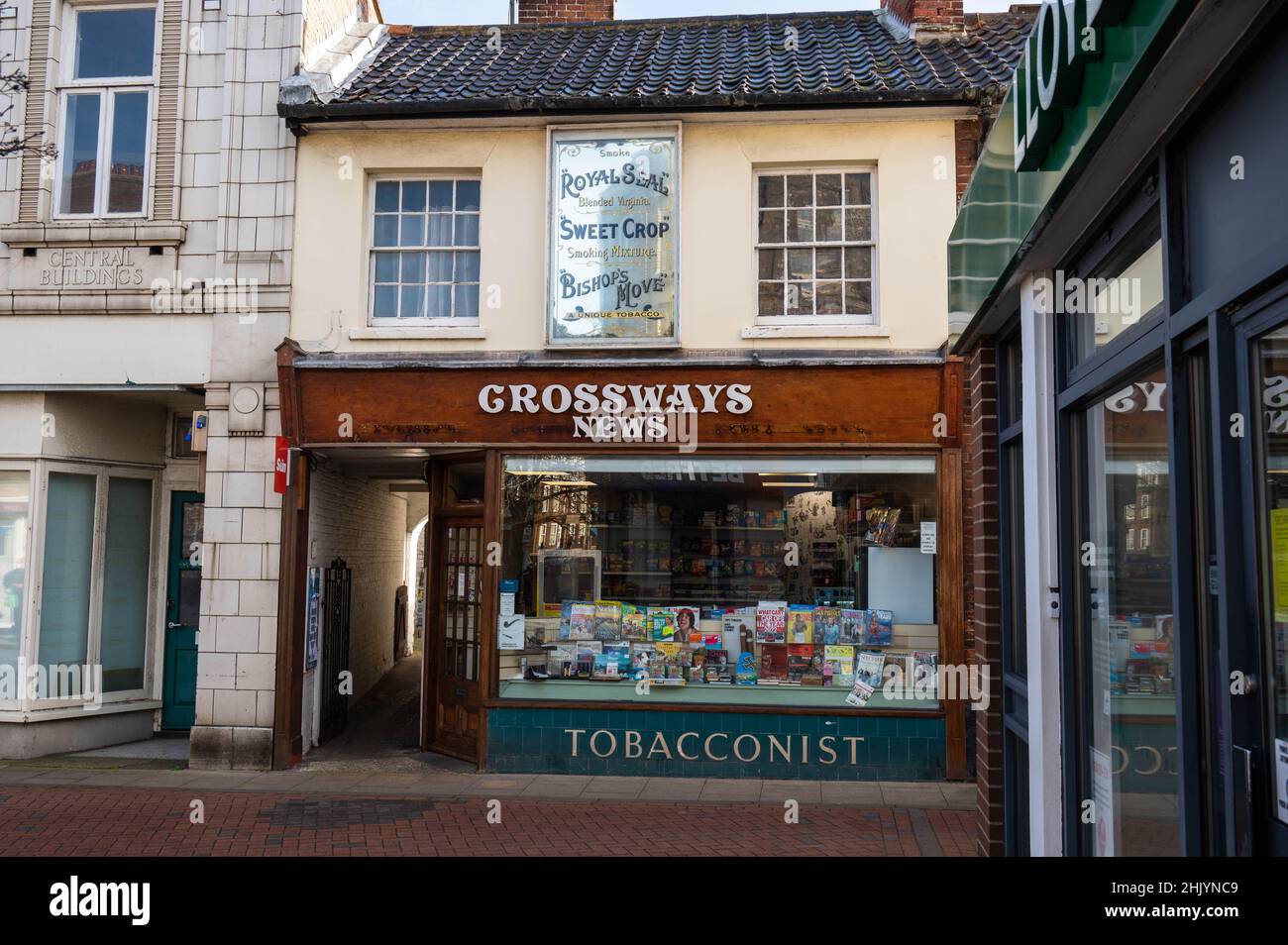 Old style tobacconist shop named Crossways with mirrored sign above the ...