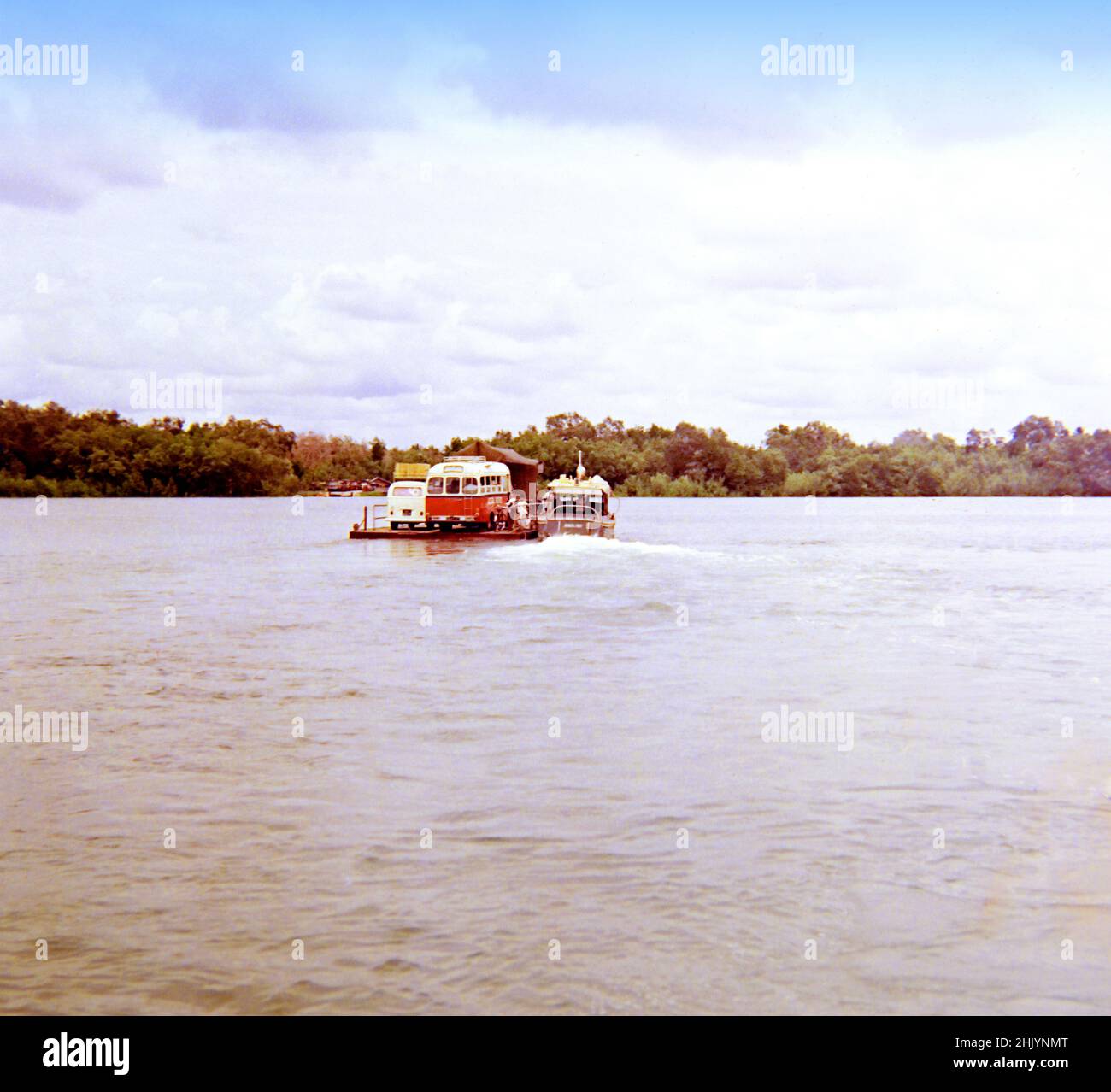 Typical road traffic river ferry crossing in Malaya 1967 Stock Photo ...