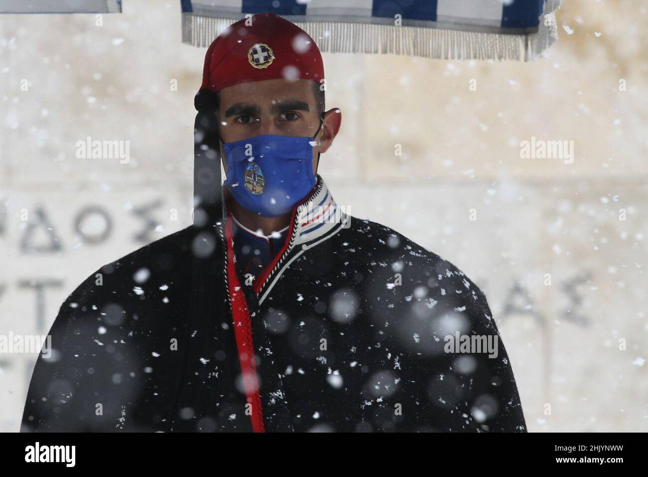Presidential guard, known as Evzonas, stands guard during a heavy ...