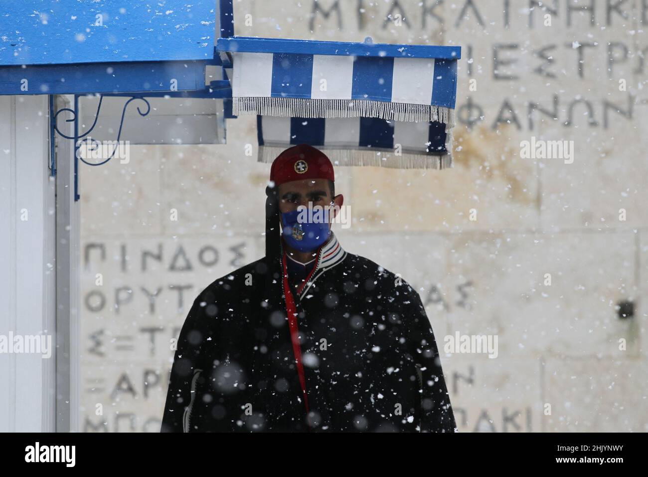Presidential guard, known as Evzonas, stands guard during a heavy ...