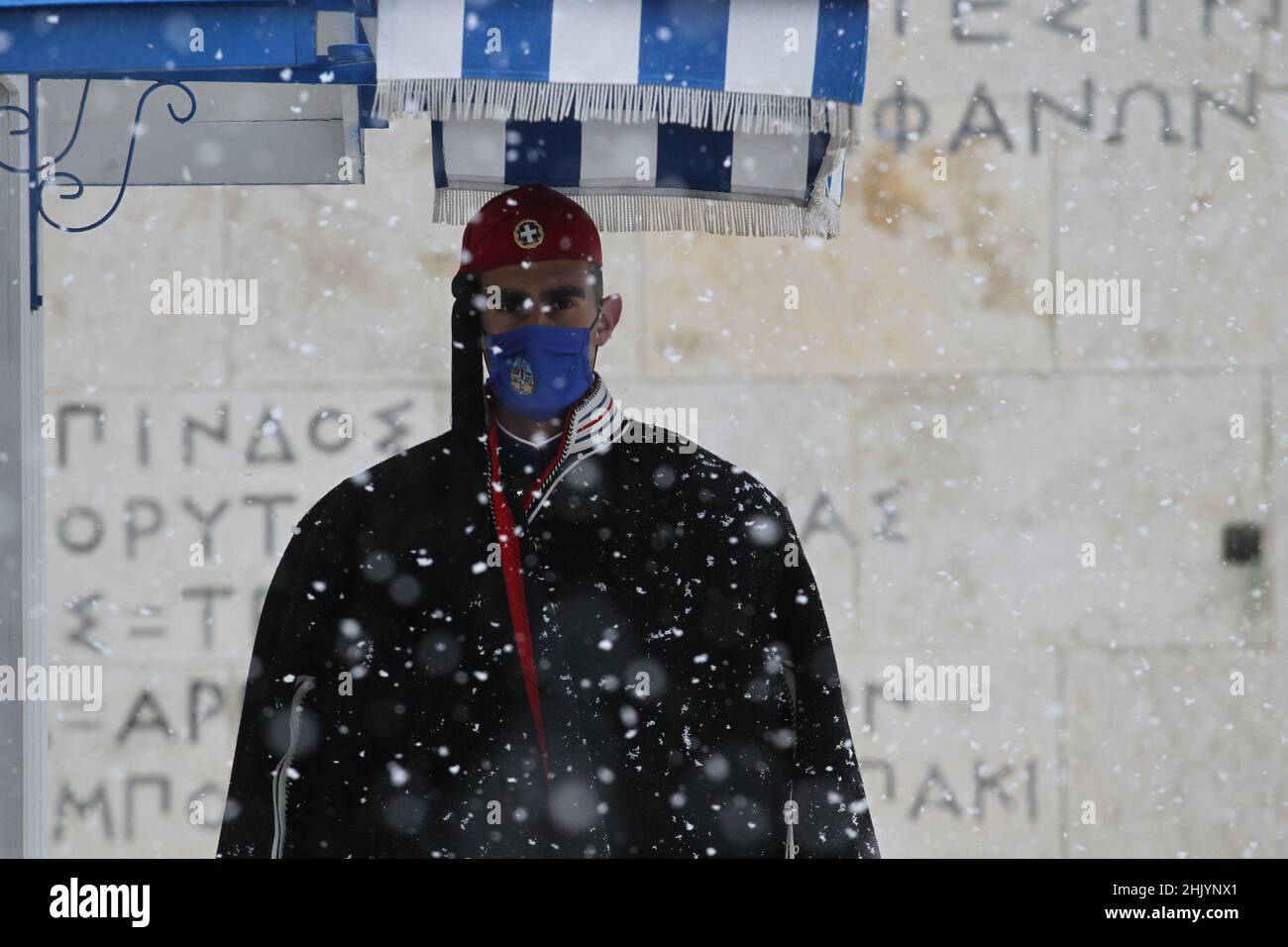 Presidential guard, known as Evzonas, stands guard during a heavy ...