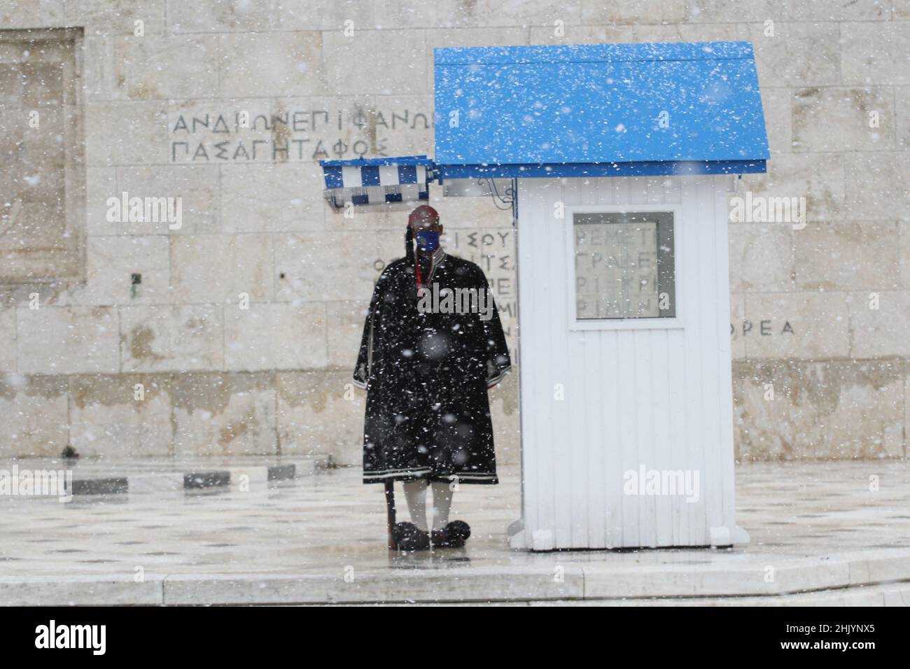 Presidential guard, known as Evzonas, stands guard during a heavy ...