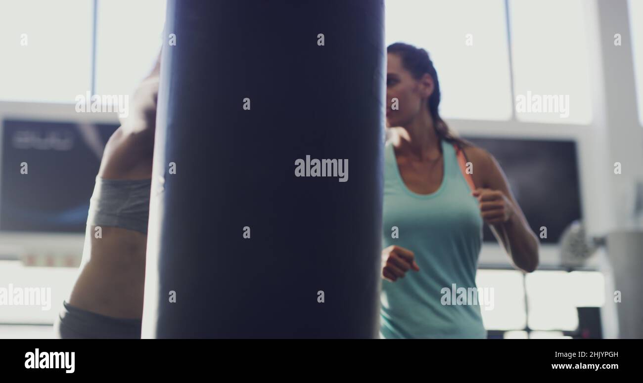 She's a fit and fierce fighter. 4k video of a woman working on her ...