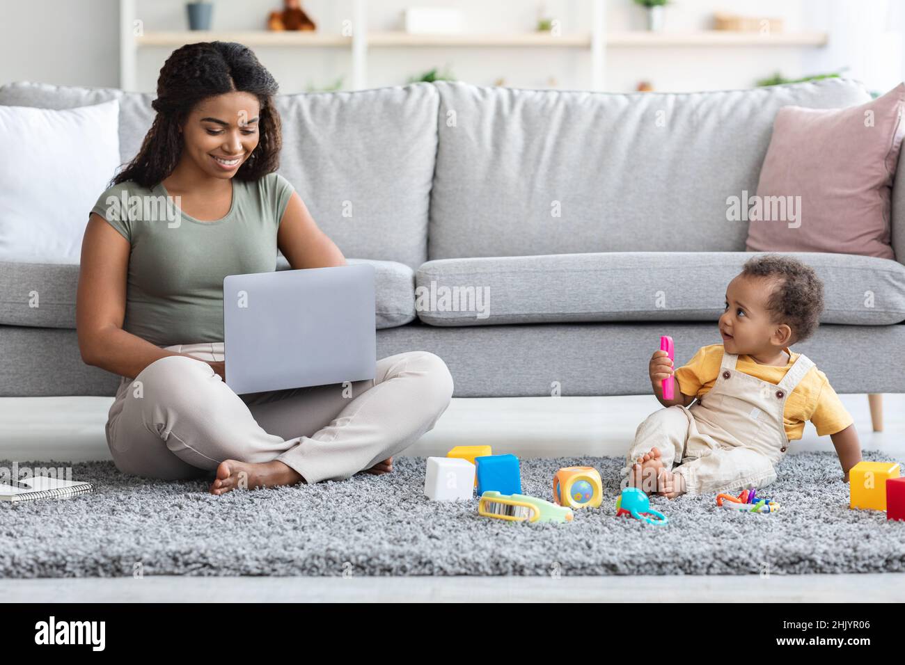 Black Freelancer Woman Working Remotely From Home And Taking Care About ...