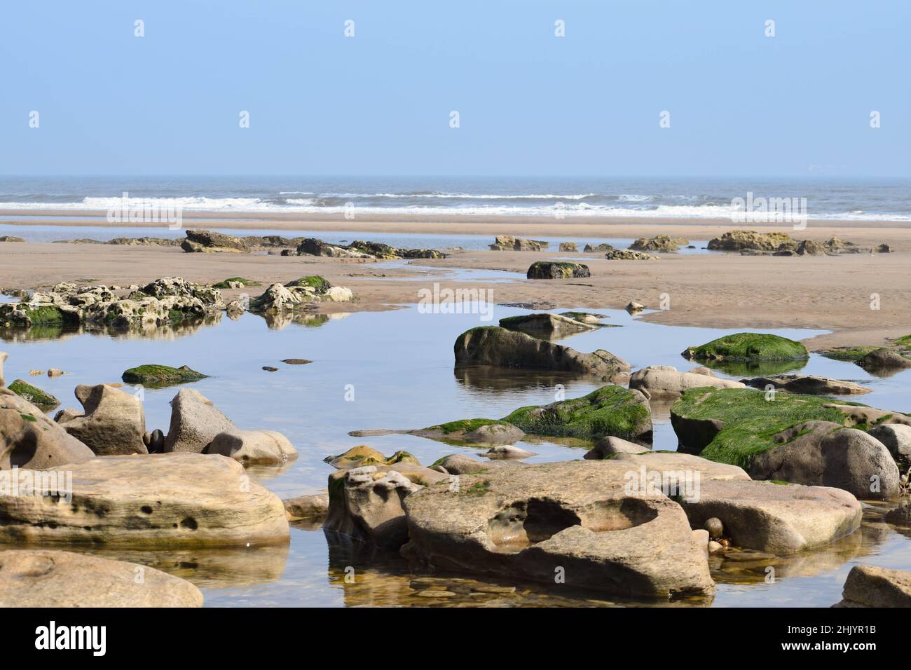 Rockpools on a beach Stock Photo - Alamy