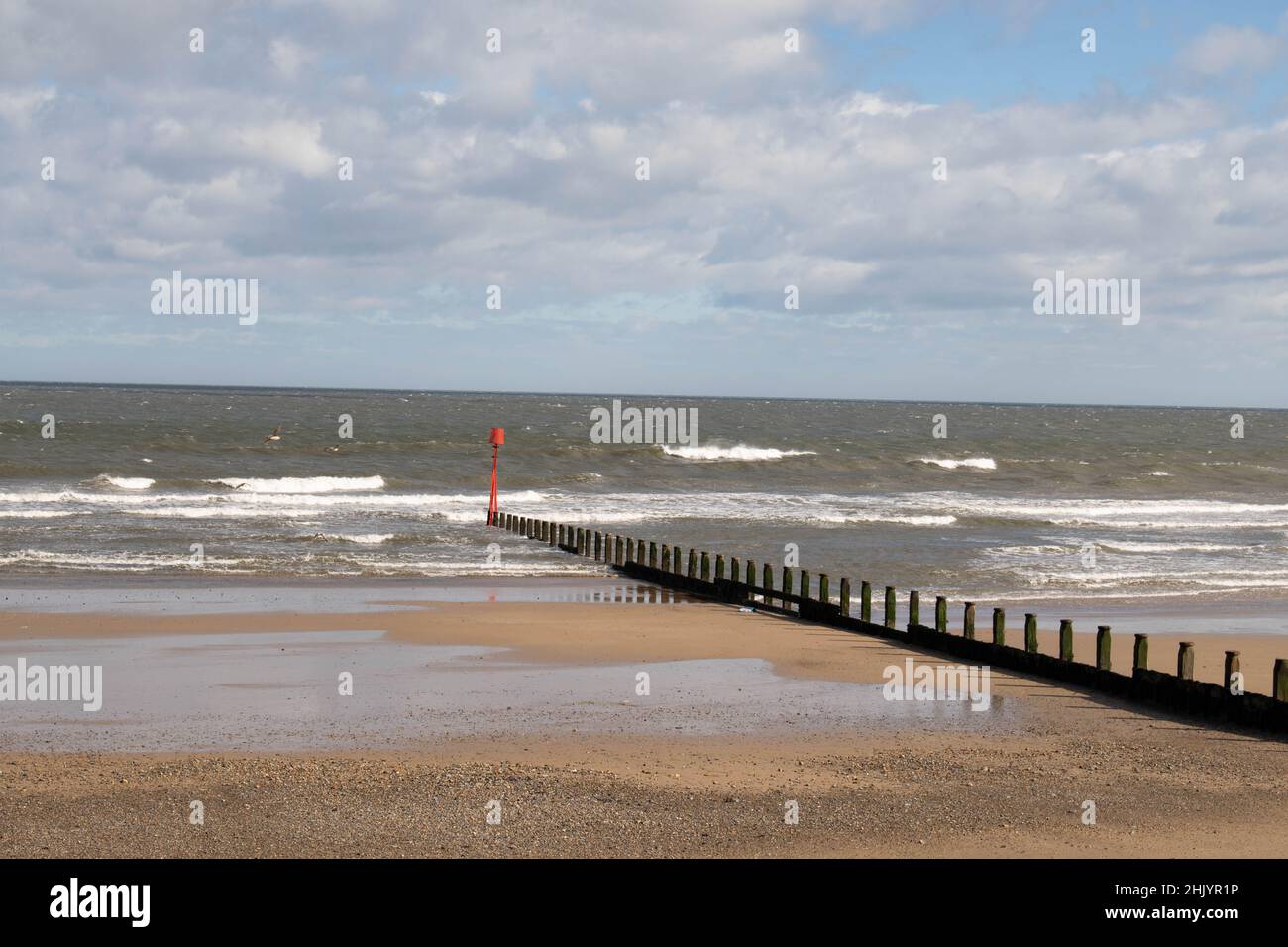 Coastal erosion beach sand waves sun hi-res stock photography and ...