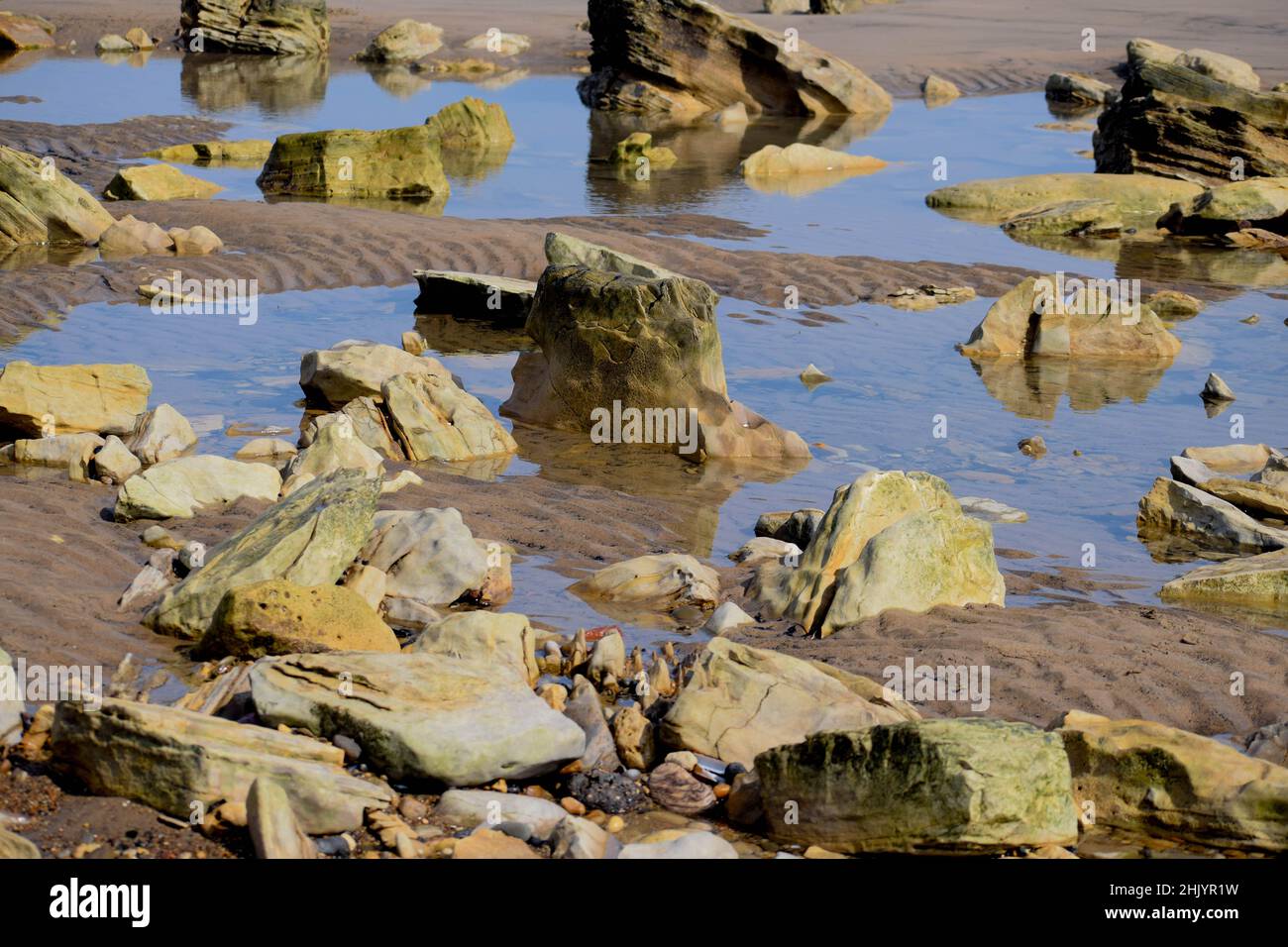 Rockpools on a beach Stock Photo - Alamy