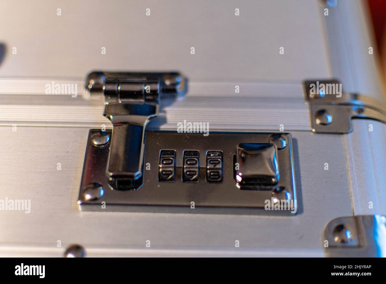 Combination lock on aluminum briefcase from the top Stock Photo - Alamy