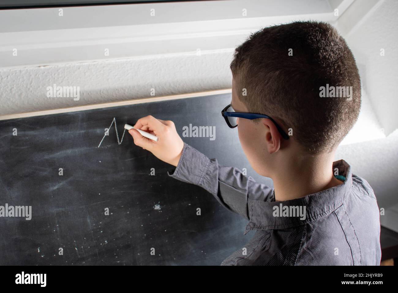 School children classroom from behind hi-res stock photography and ...