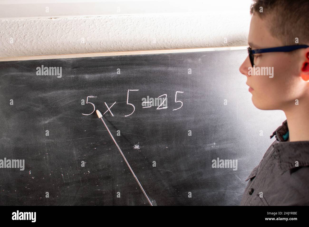 Boy lecturing mathematics at a blackboard Stock Photo - Alamy