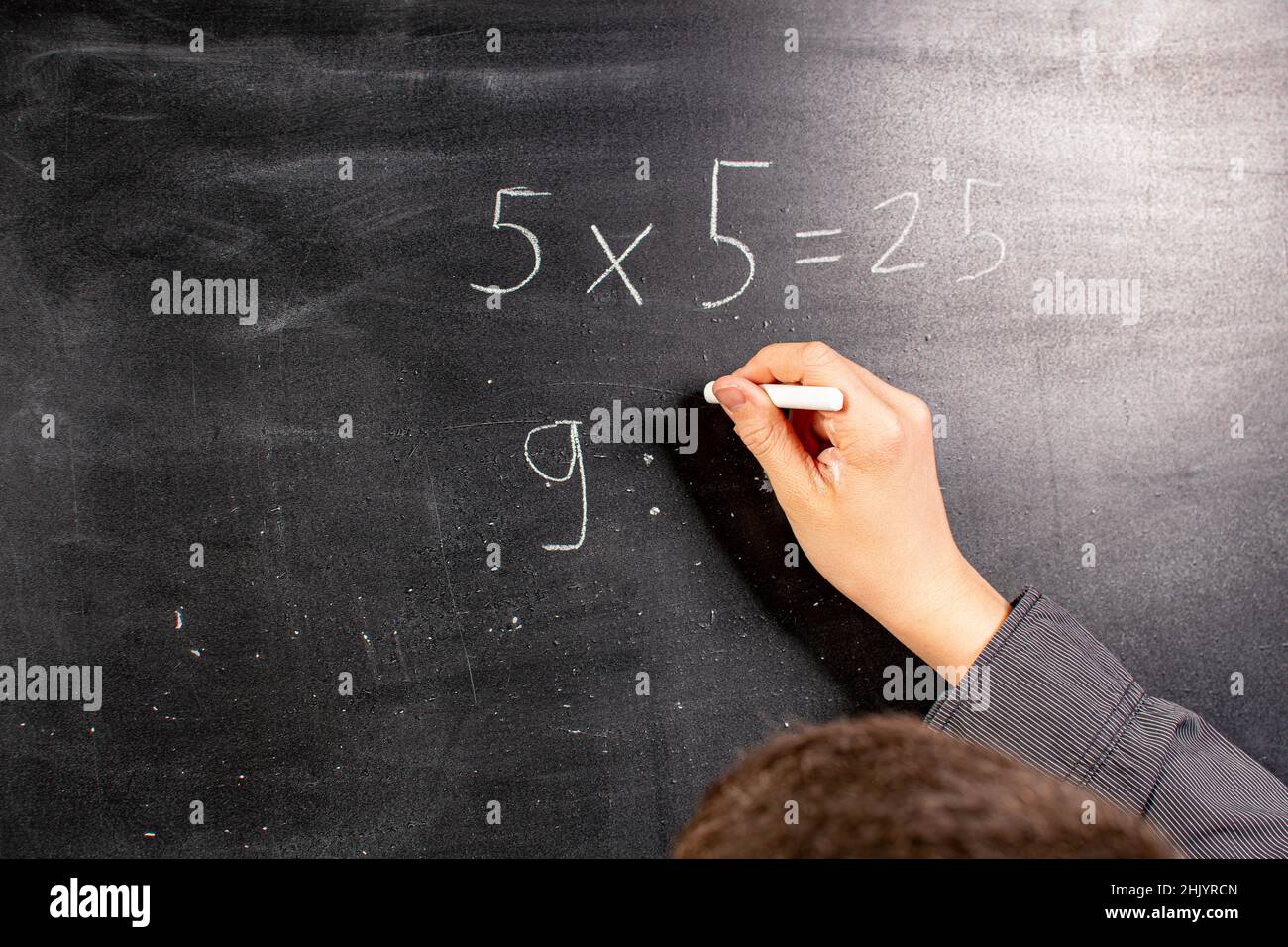 Boy lecturing mathematics at a blackboard Stock Photo - Alamy
