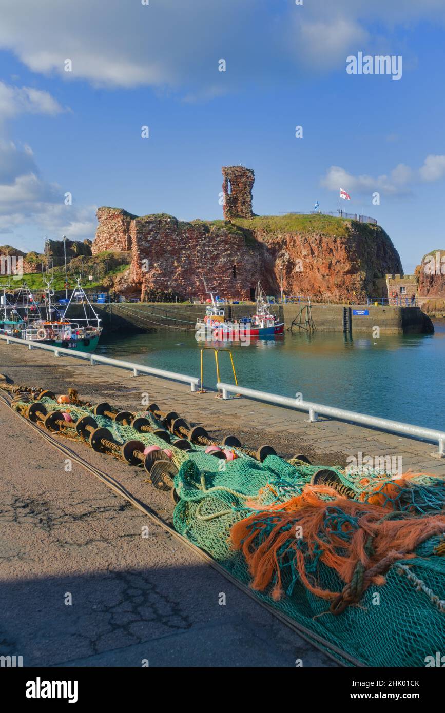 Looking west over Dunbar Harbour to ancient historic Castle ruins ...