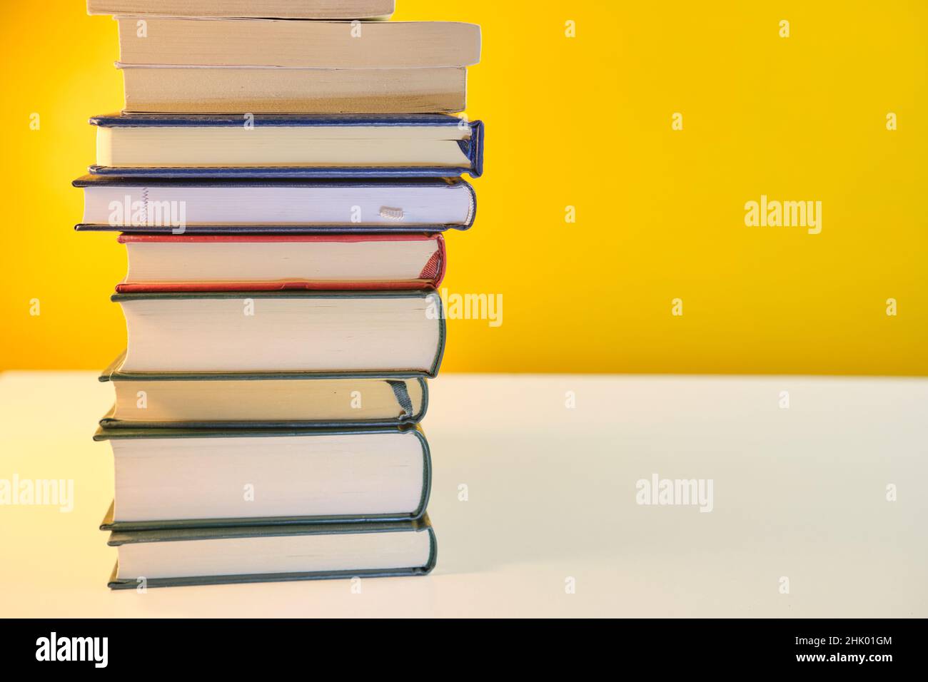Collection of Book stack in the library room on yellow background Stock ...