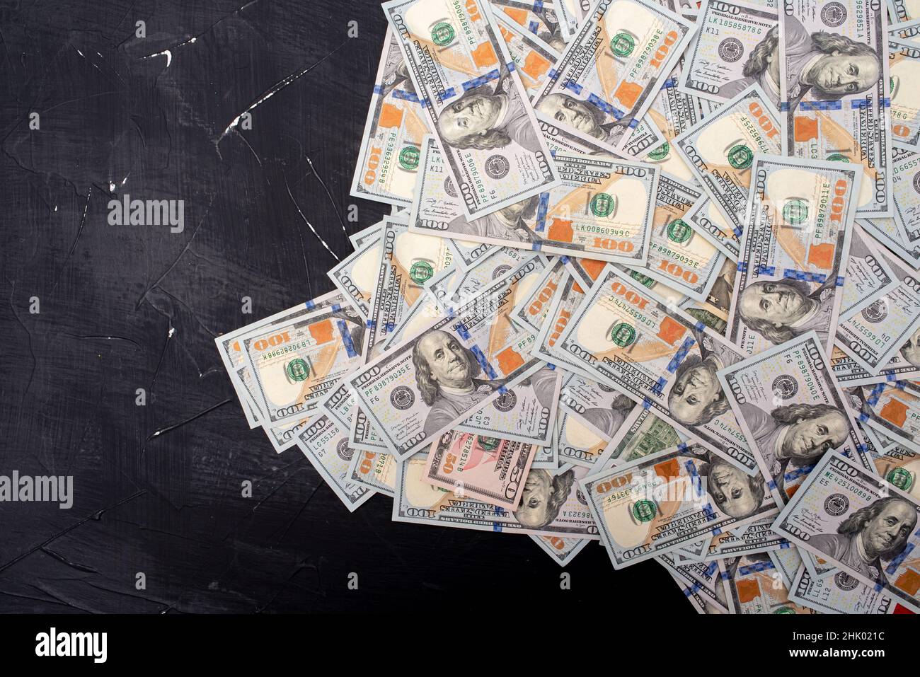 Paper notes dollars on a black background. Money and financial concept ...