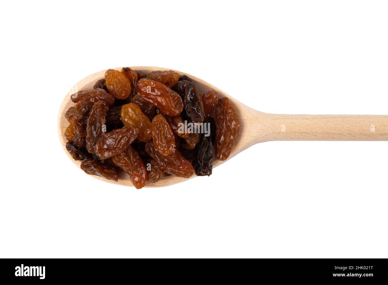 royal raisins on wooden spoon isolated on white background. Spice and ...