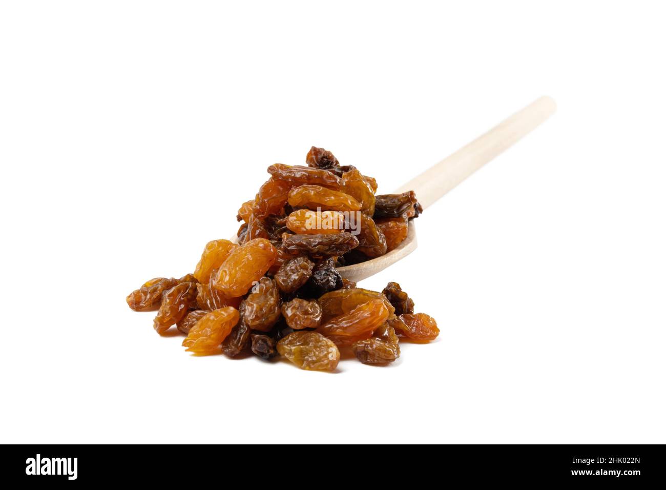 royal raisins on wooden spoon isolated on white background. Spice and ...