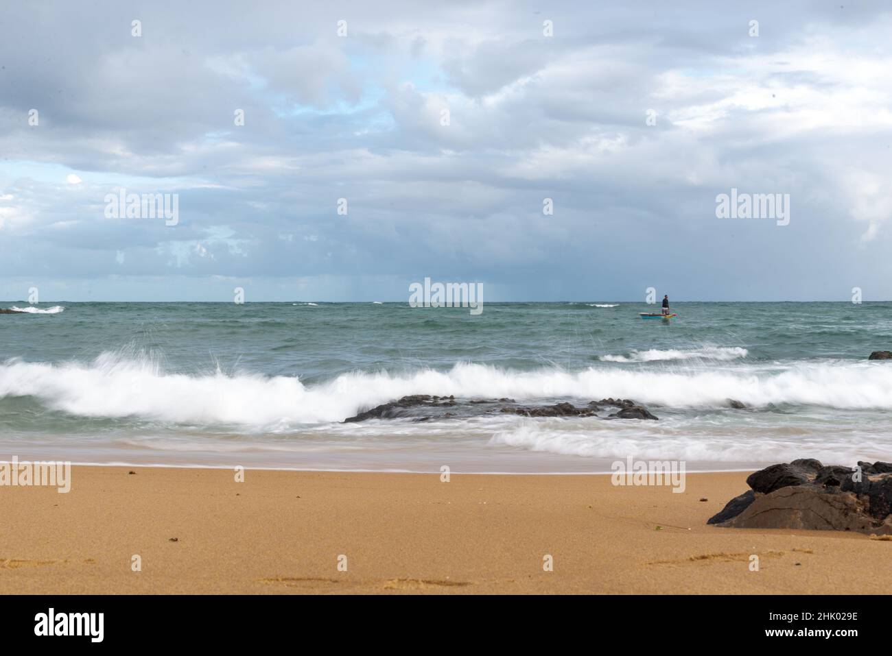Ocean waves breaking on the sands of the famous Rio Vermelho beach ...