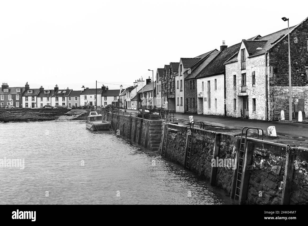 Black and white image of harbour, buildings and boat Stock Photo - Alamy